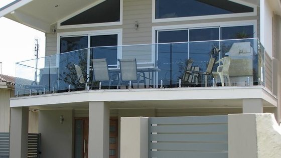 Exterior balcony glass balustrade with stainless steel spigots glass railing