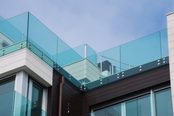 Tempered tinted glass railing with stainless steel standoff / patch fitting railing