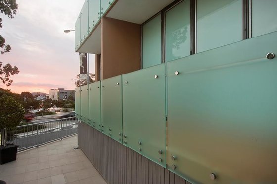 Tempered tinted glass railing with stainless steel standoff / patch fitting railing