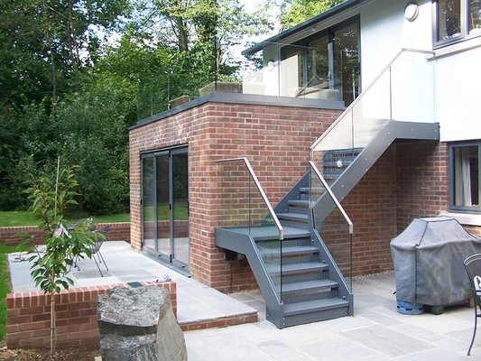 Exterior straight staircase with carbon steel stringer for building design