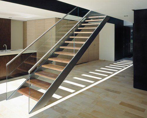 Interior wooden straight staircase with glass railing free design