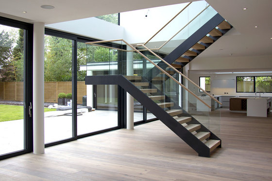 Interior wooden straight staircase with glass railing free design