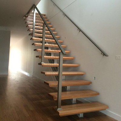 Stainless steel center stringer straight solid wood staircase with glass balustrade