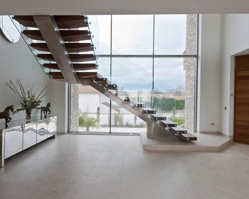 Carbon steel center stringer L-shape solid wood staircase with glass railing