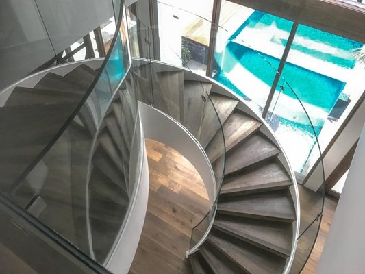 Interior modern glass wood tread curved stair / staircase design