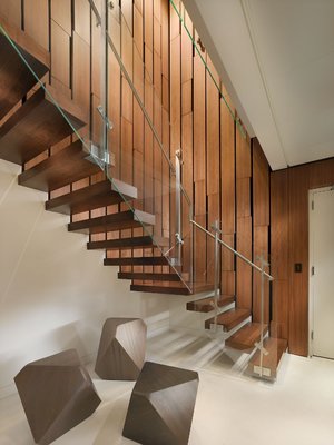 Solid wood floating staircase with glass railing for luxury house design