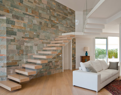 Solid wood floating staircase with glass railing for luxury house design