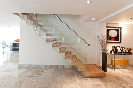 luxury house design wooden floating staircase with glass railing