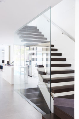 Interior glass wall railing floating staircase with wooden steps design
