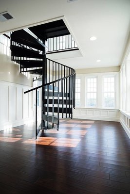 Duplex use spiral staircase with stainless steel railing design