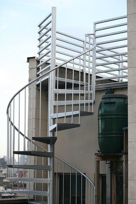 Duplex use spiral staircase with stainless steel railing design