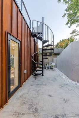 Inside spiral staircase with stainless steel railing design