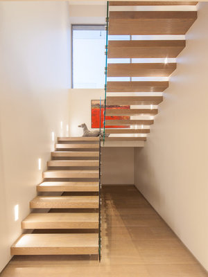 Interior wood closed tread floating staircase for Mauritius design