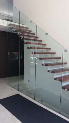 Interior wood closed tread floating staircase for Mauritius design