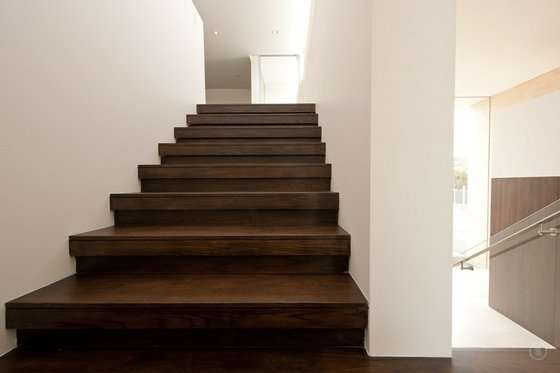 Interior wood closed tread floating staircase for Mauritius design