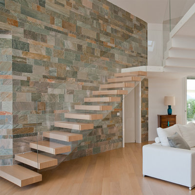floating stairs with wooden tread and frameless glass railings