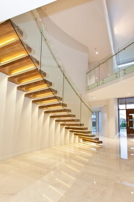 Clear glass railing floating stair with Led light