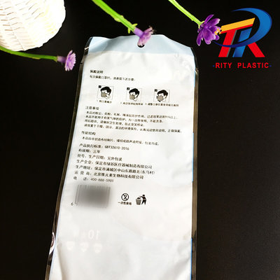 PET/PE mask packaging bag printing laminate plastic bag with portable handle ordinary 3sides sealing bag supplier