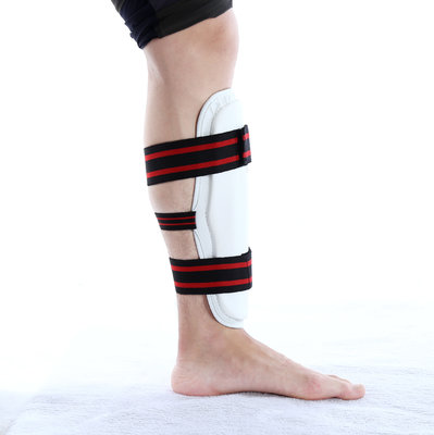 Custom LOGO high quality sparring gear protective shin guards for taekwondo shin protector PU+EVA+Sponge supplier