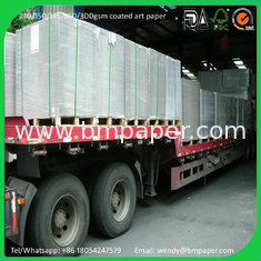 China 80 90 100 250 270 280 300 350 g gram gra gsm c2s coated glossy art paper couche paper with package in roll or in ream supplier