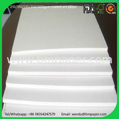 China 115 120 128 130 135 140 150 157 g gram gra gsm c2s coated glossy art paper couche paper with package in roll or in ream supplier
