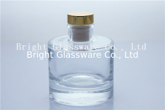round glass perfume bottle with wooden lid