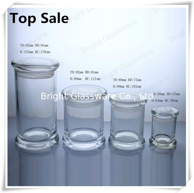 a series of different size glass jars for candles in stock