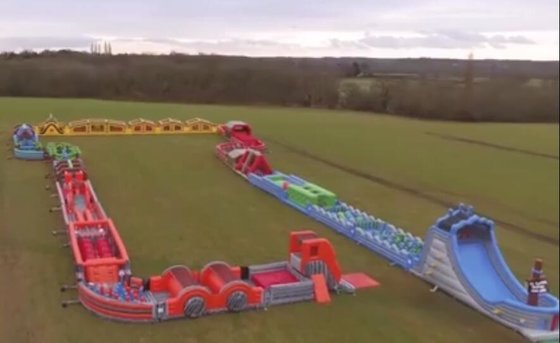 Giant inflatable amusement park or adventure park settle in plain & grassland for family
