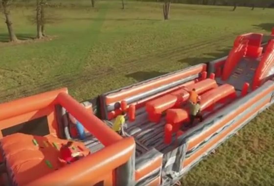 Giant inflatable amusement park or adventure park settle in plain & grassland for family