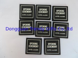China Custom Estee Lauder 3d Soft PVC Lapel Garment Label Black Color For Open Ceremony , Durable And Waterproof supplier
