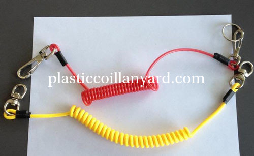 Flexible transparent yellow expanding spring coil tool lanyard with 2pcs oval metal hooks supplier