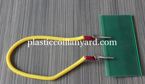 Custom yellow color spring coiled lanyard tether with silver metal thin clip for napkins supplier