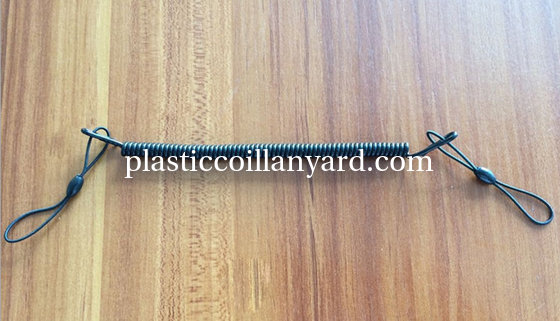 Retracted black short length coiled tool lanyard custom with webbing cord loop on two ends supplier