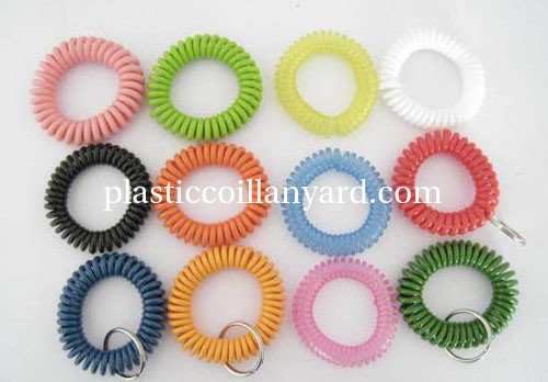 12pcs assorted color plastic spiral coil wrist band key ring chain coil bracelet w/keyring supplier