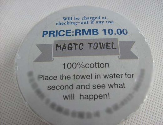 compressed round good quality hotel towel