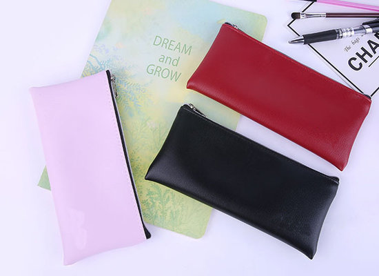 Plain color student pen bag female simple large capacity PU handbag makeup bag supplier