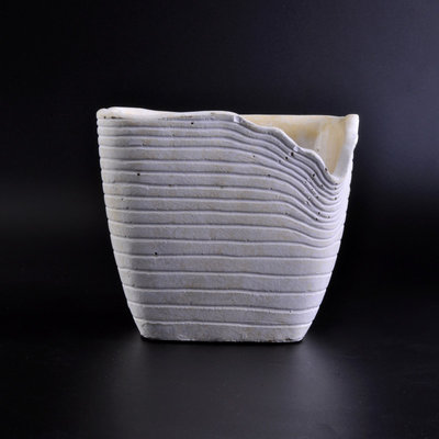 White ceramic candle vessel with glazing finish