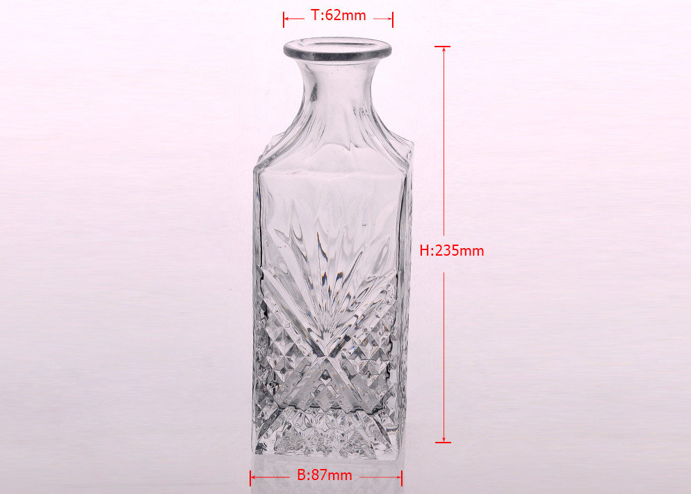 Superior embossed clear Glass Wine Bottles with cork lid , Machine made