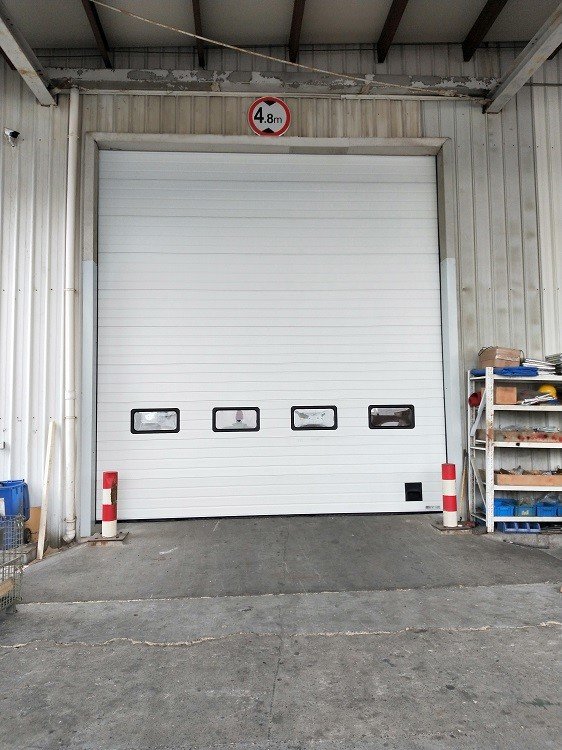 sandwich shape Security standard sectional garage door with small door and small house