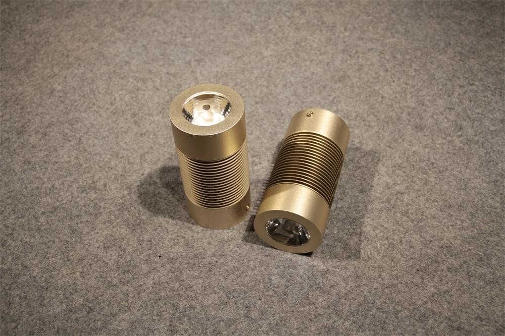 LED Surface-Mounted Downlight with champagne gold color, lens, round shape