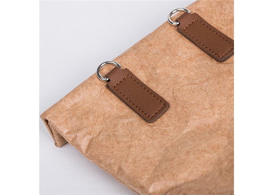 Brown paper tyvek bags with snap closure and buckle closure for shopper