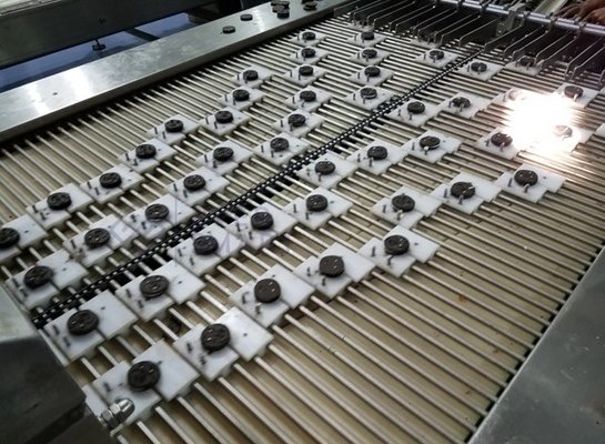 Four lane biscuit sandwiching machine with row multiplier