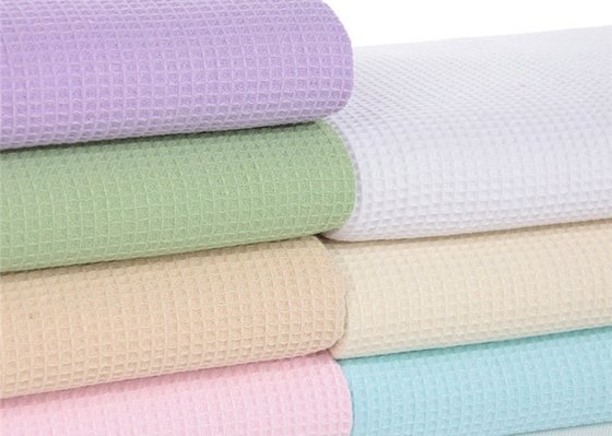 100%cotton knitted fabric popular in autumn/winter CVC waffle fabric for hotel pajamas, nightgowns and slippers supplier