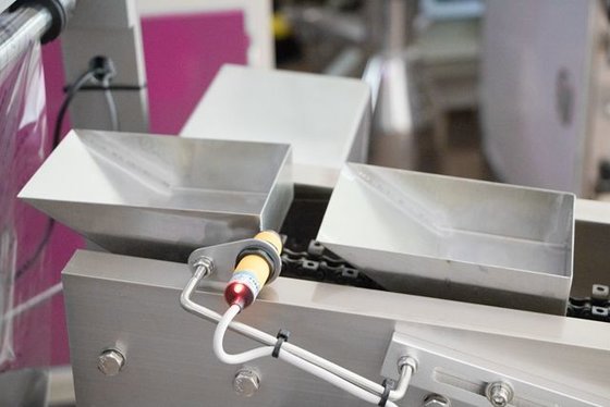 Taichuan Automatic bucket chain feeding vertical form fill seal food packing machine in business