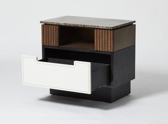 The Ritz Carlton 5-star luxury hotel guestroom walnut wood one white drawer nightstand