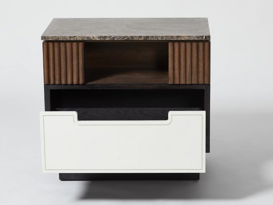 The Ritz Carlton 5-star luxury hotel guestroom walnut wood one white drawer nightstand