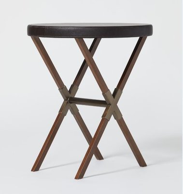 Antique brushed bronze metal base with upholstered leather top round hotel guestroom side table
