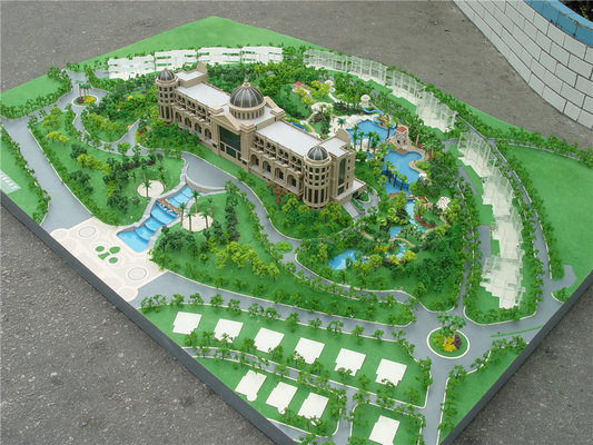 Physical scale model with warm lighting for building construction presentation
