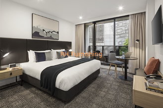 Budget hotel bedroom furniture of PU leather upholstery bed and Laminate desk with TV cabinets