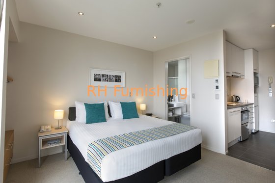 Fashion hotel style apartment usd laminate kitchen cabinets with Upholstered bed and Sofa chairs supplier